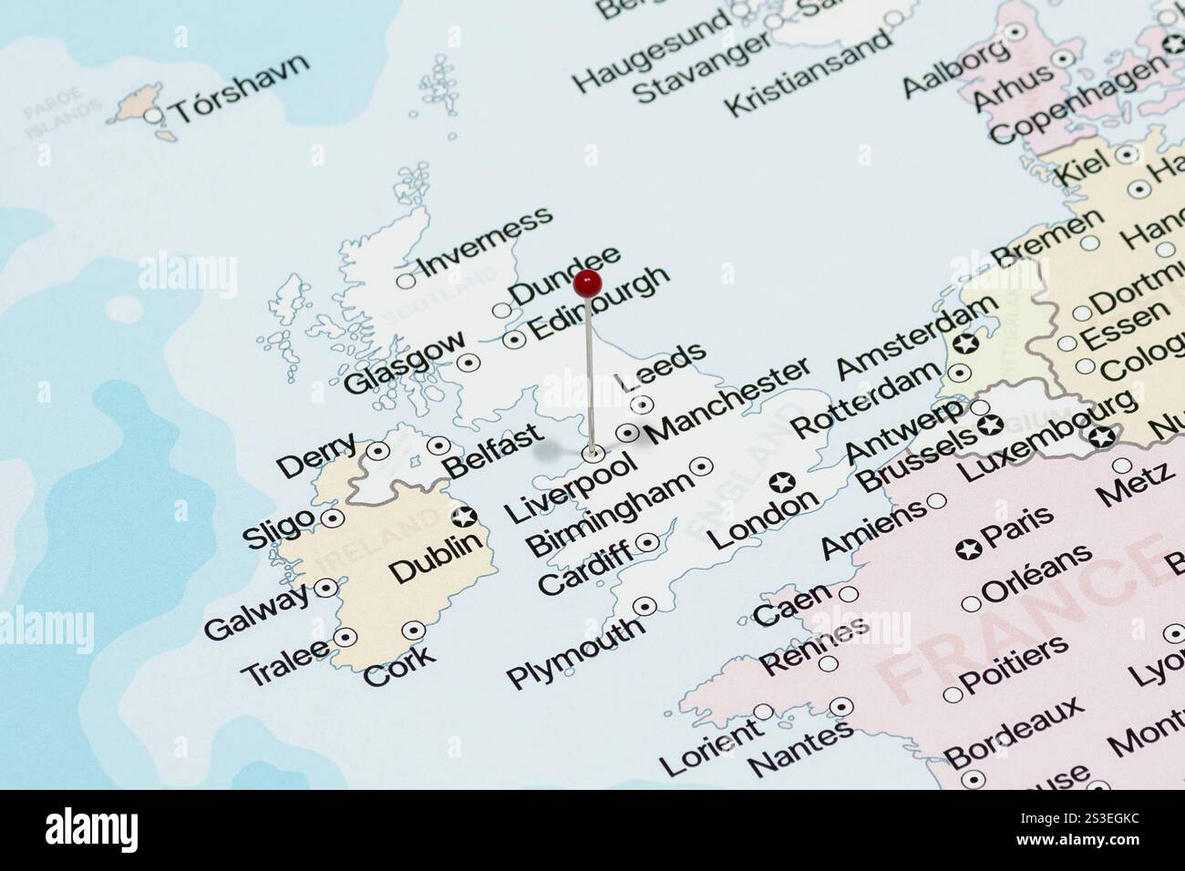 Macro photo of a red pin needle into Liverpool city of England ...