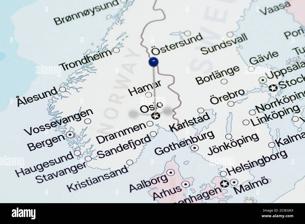 Close up to a blue pin needle into Oslo city of Norway political map ...