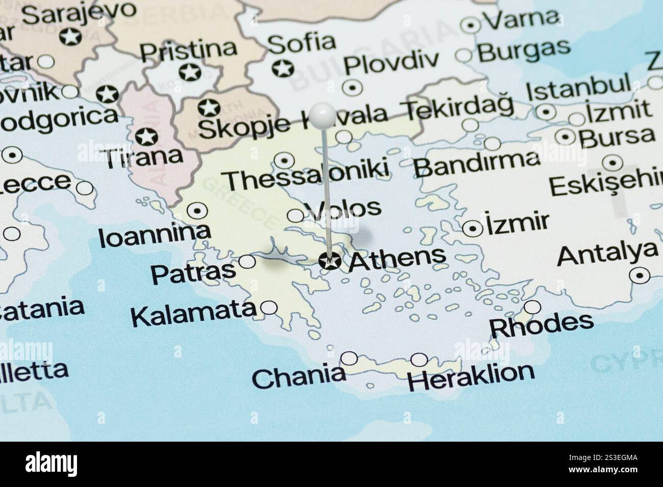 Close up to a white pin needle into Athens city of Greece political map ...