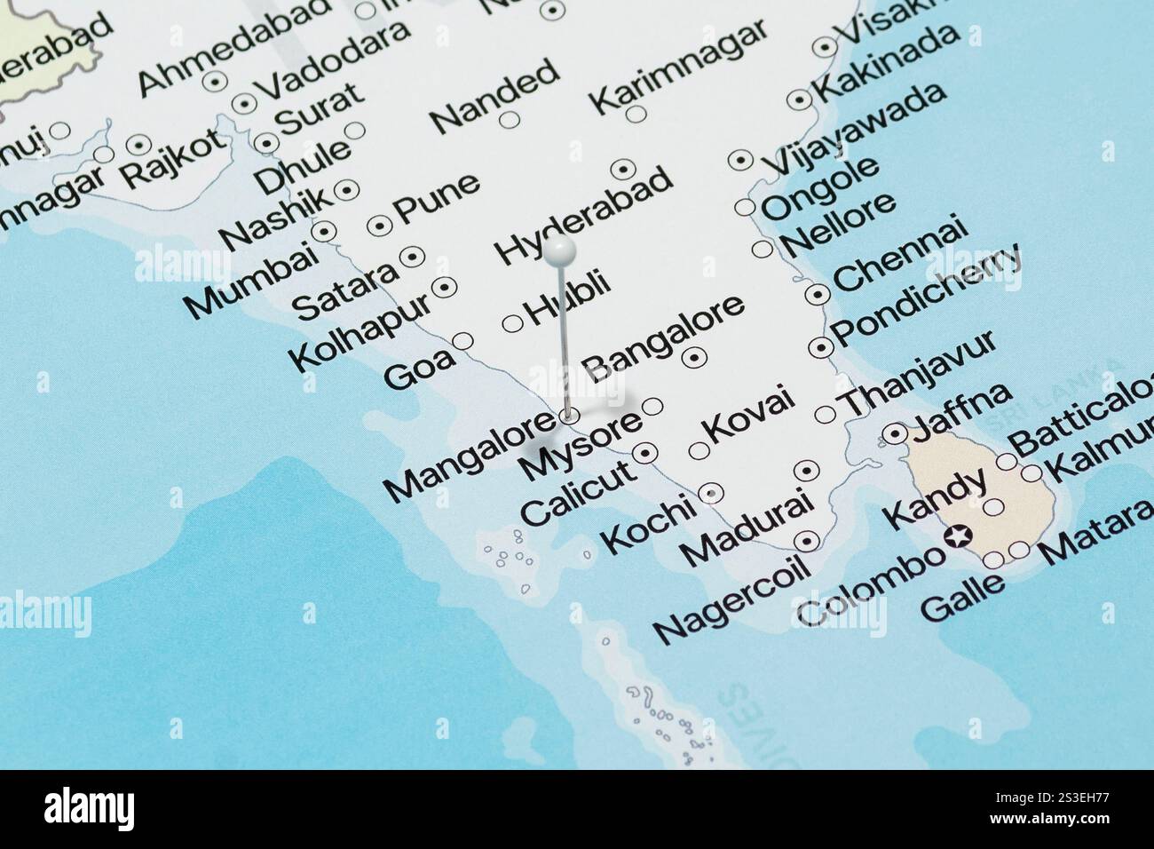 Macro photo of a white pin needle into Mangalore city of India ...