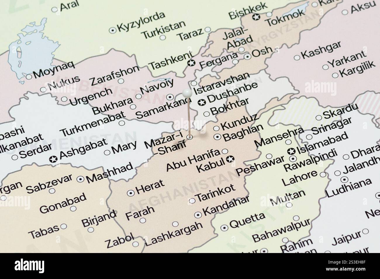Macro photo of a white pin needle into Mazar i Sharif city of ...