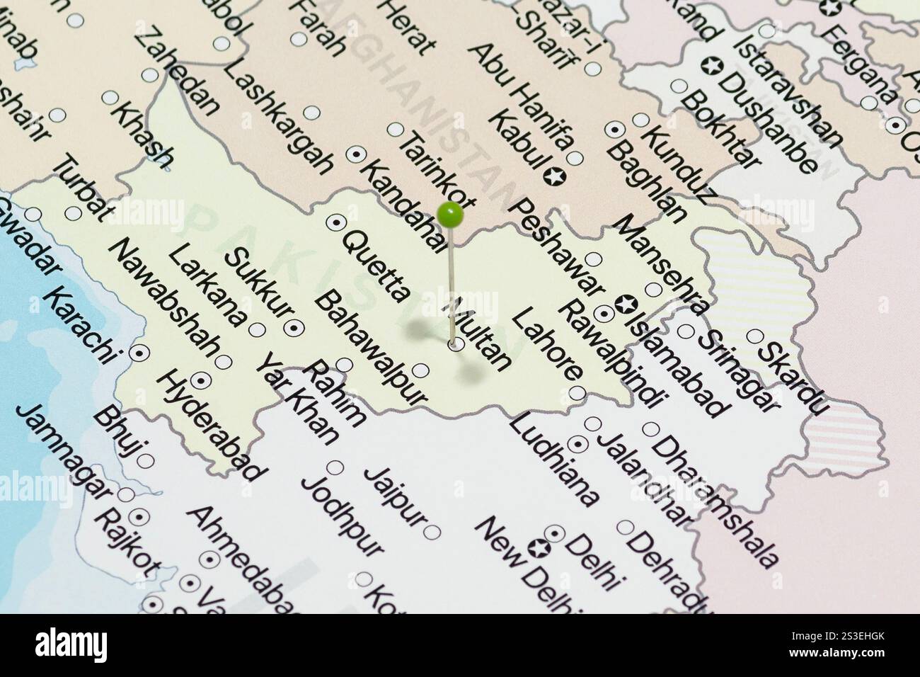 Macro photo of a green pin needle into Multan city of Pakistan ...