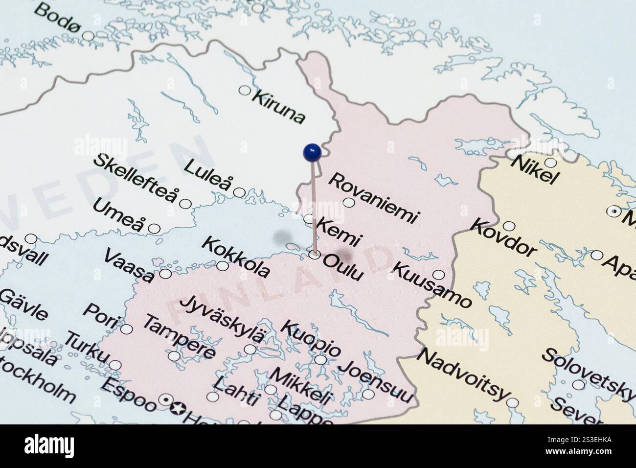 Macro photo of a blue pin needle into Oulu city of Finland political ...