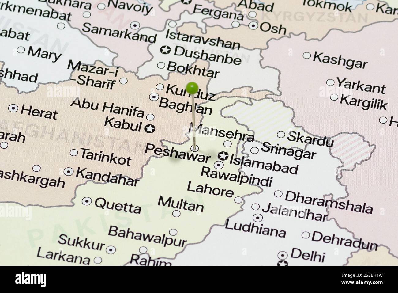 Macro photo of a green pin needle into Peshawar city of Pakistan ...