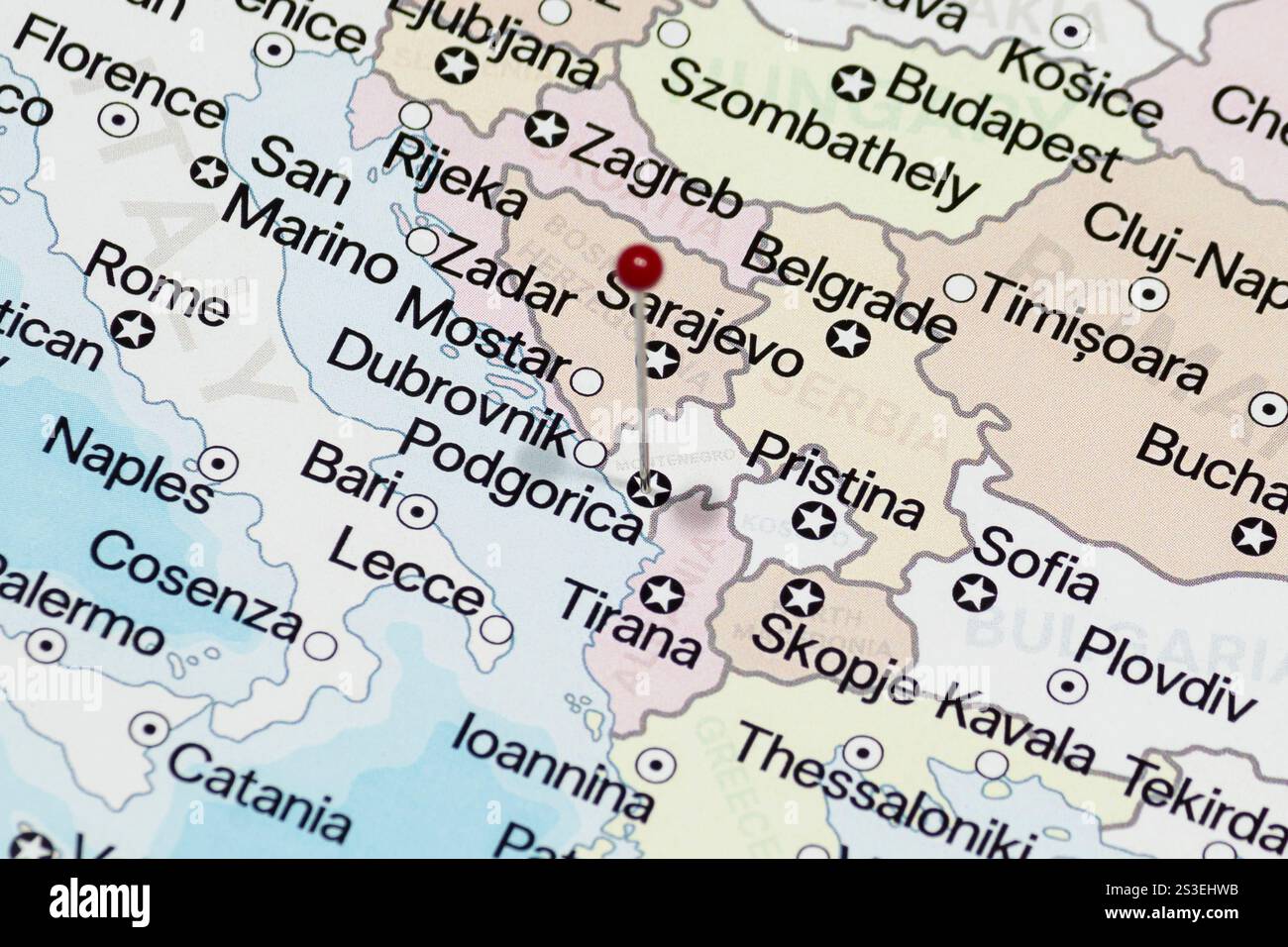 Macro photo of a red pin needle into Podgorica city of Montenegro ...