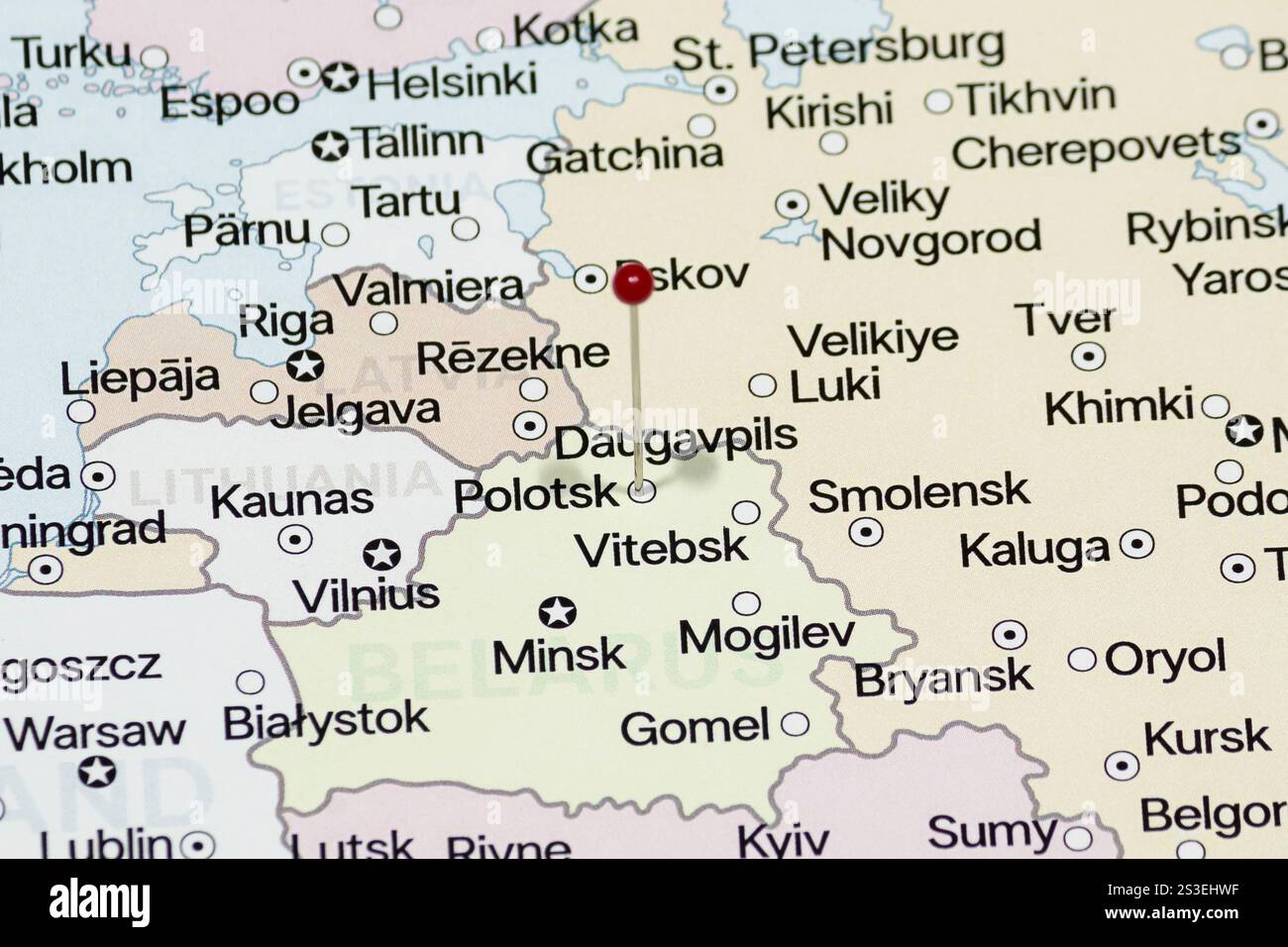 Macro photo of a red pin needle into Polotsk city of Belarus political ...