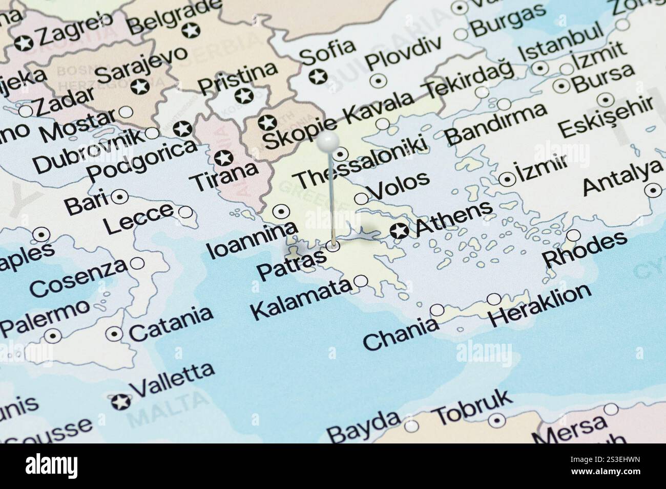 Macro photo of a white pin needle into Patras city of Greece political ...