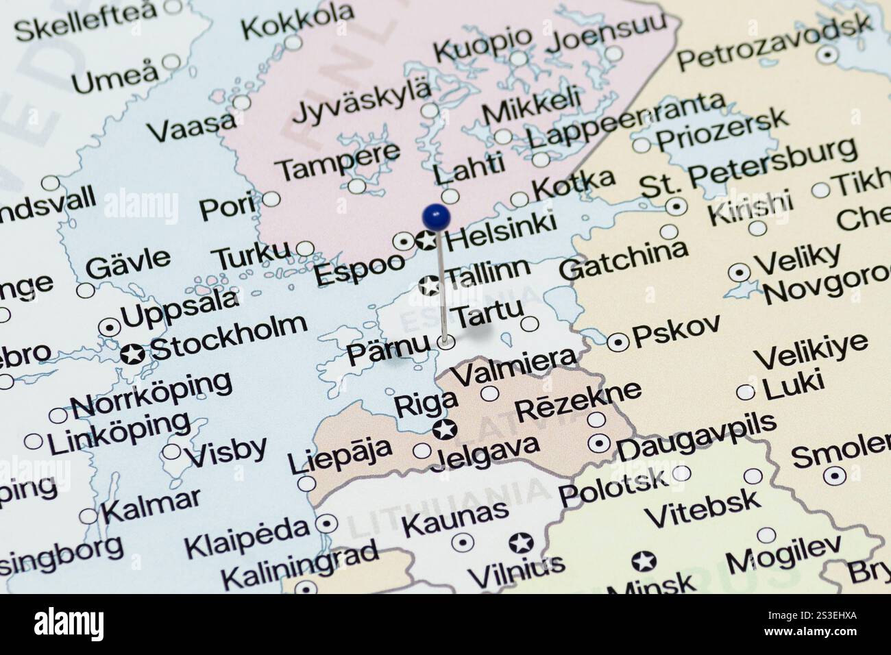Macro photo of a blue pin needle into Parnu city of Estonia political ...