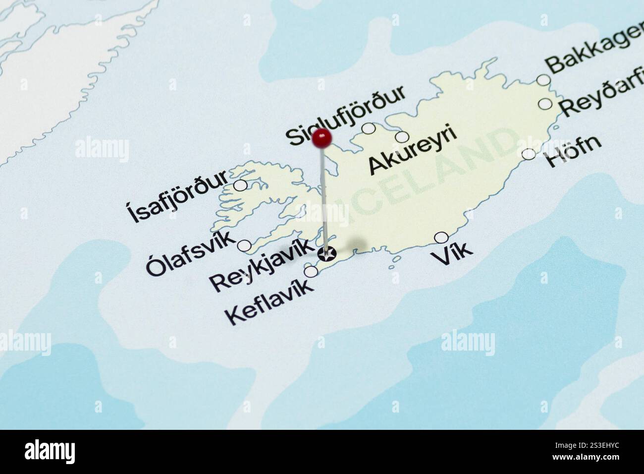 Macro photo of a red pin needle into Reykjavik city of Iceland ...