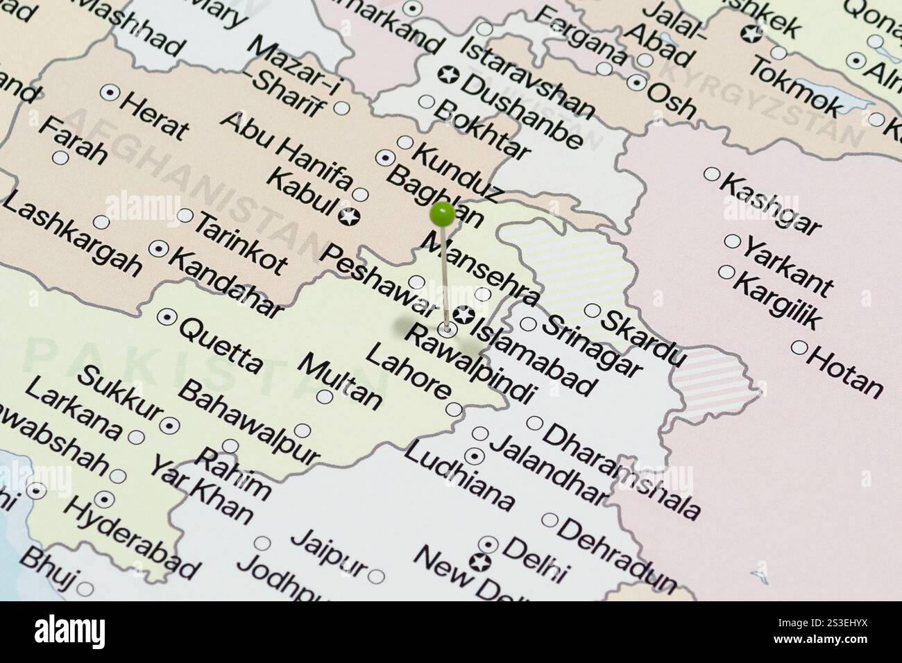 Macro photo of a green pin needle into Rawalpindi city of Pakistan ...