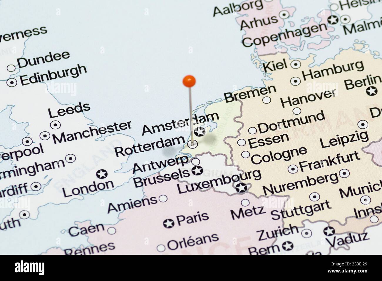 Macro photo of an orange pin needle into Rotterdam city of Netherlands ...