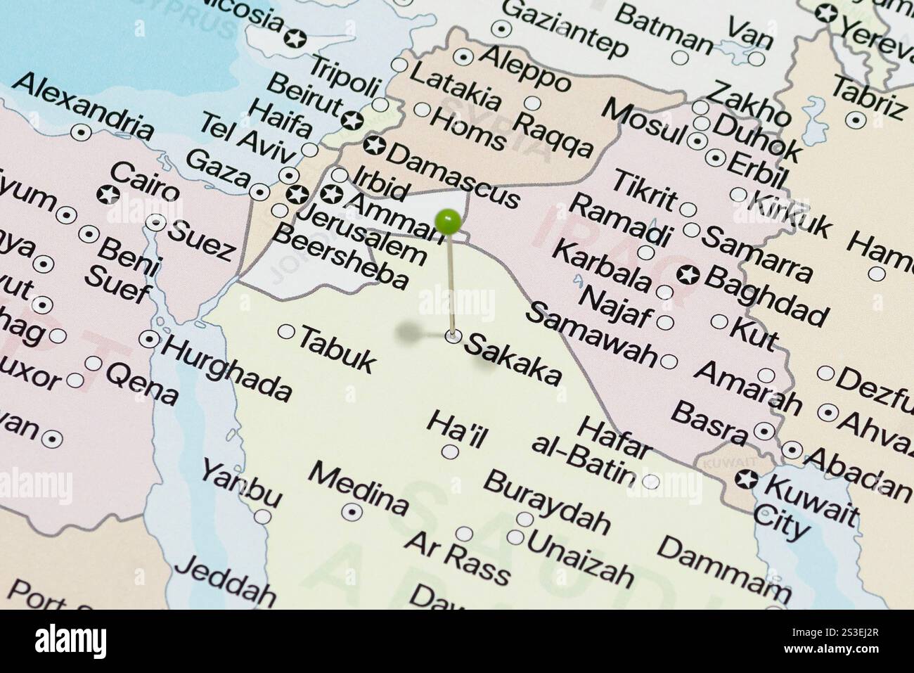 Macro photo of a green pin needle into Sakaka city of Saudi Arabia ...