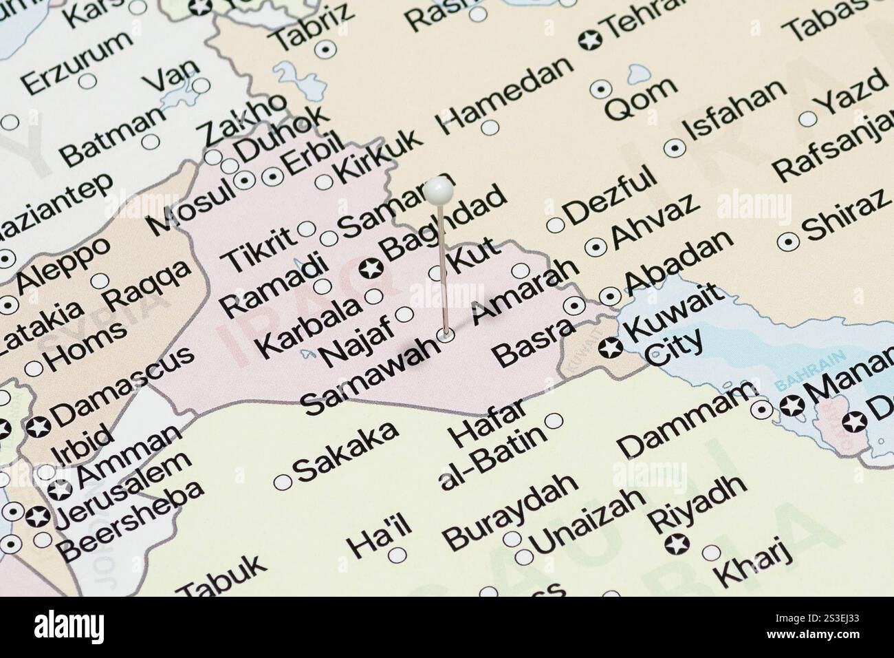 Macro photo of a white pin needle into Samawah city of Iraq political ...