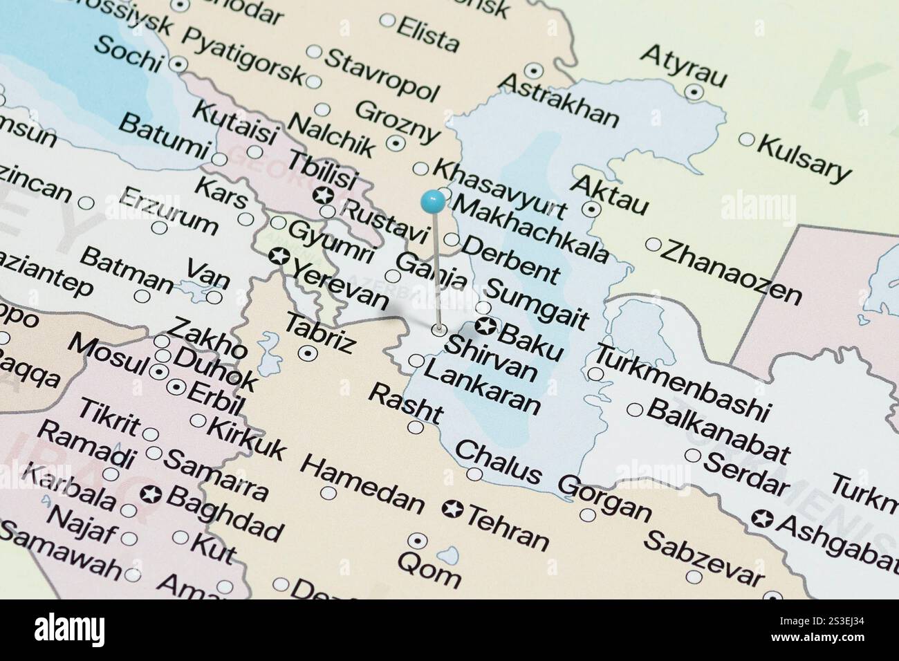 Macro photo of a green pin needle into Shirvan city of Azerbaijan ...