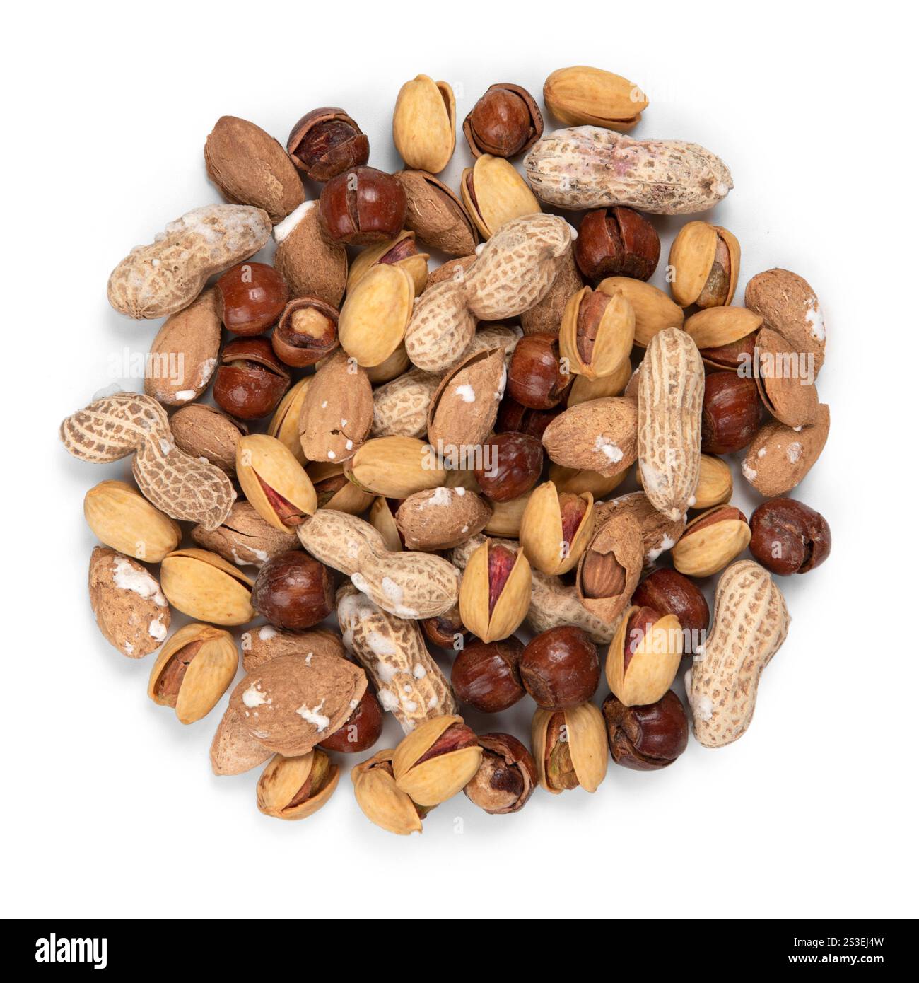 A circular arrangement of pistachios, peanuts in shells, almonds in ...