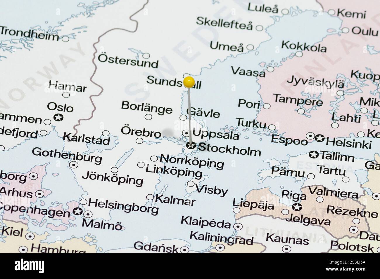 Macro photo of a yellow pin needle into Stockholm city of Sweden ...