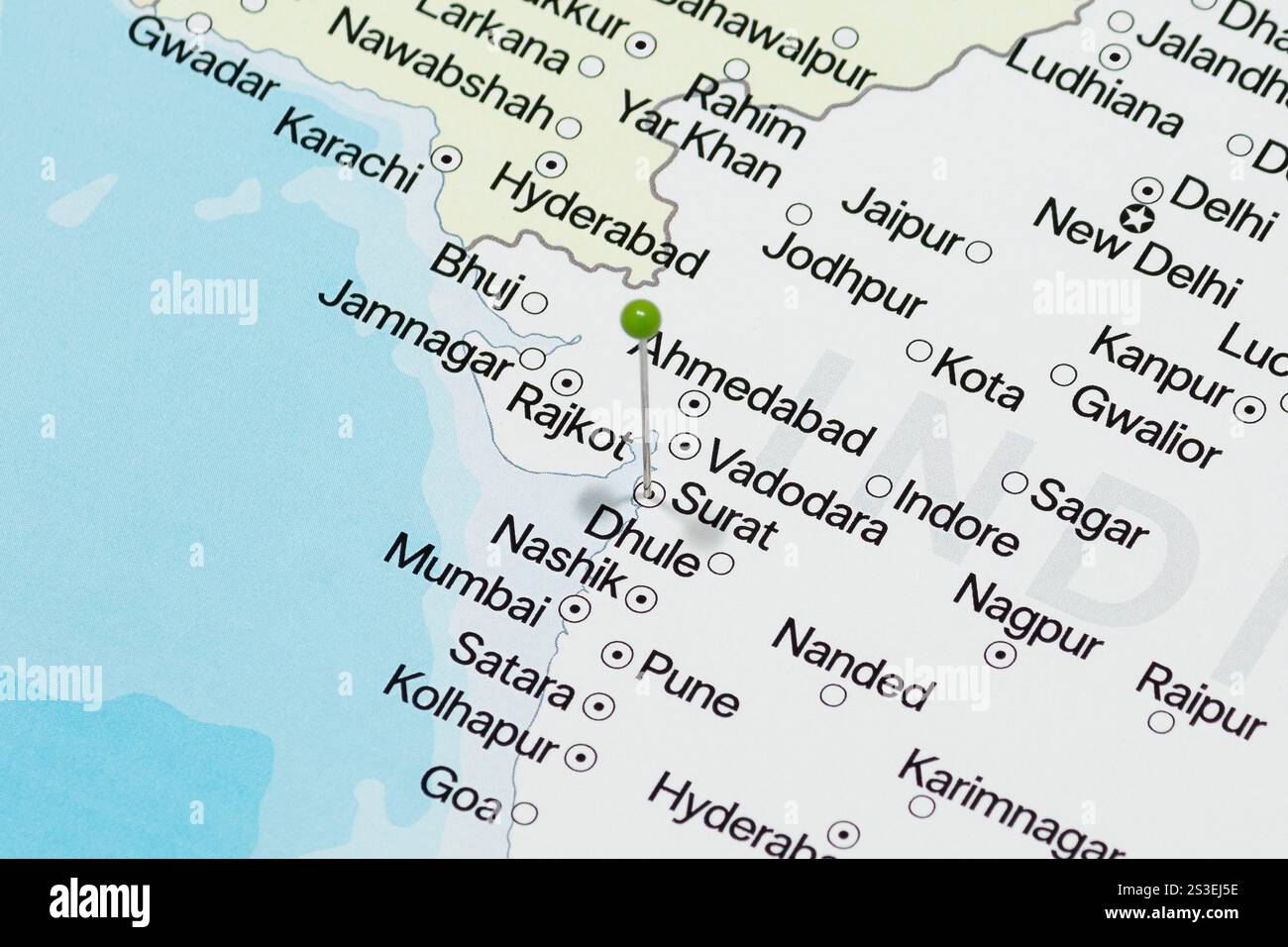 Macro photo of a white pin needle into Surat city of India political ...