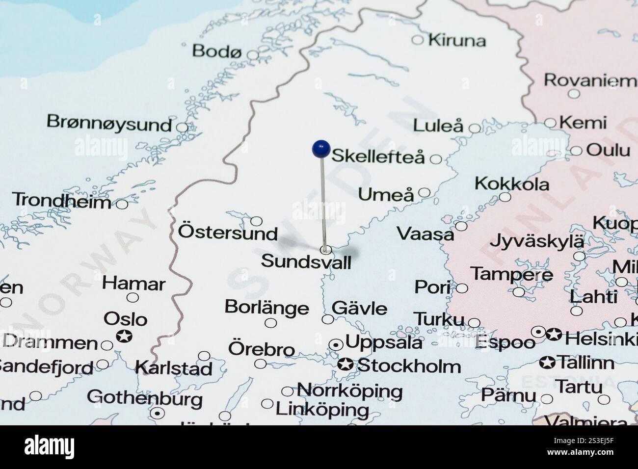 Macro photo of a blue pin needle into Sundsvall city of Sweden ...