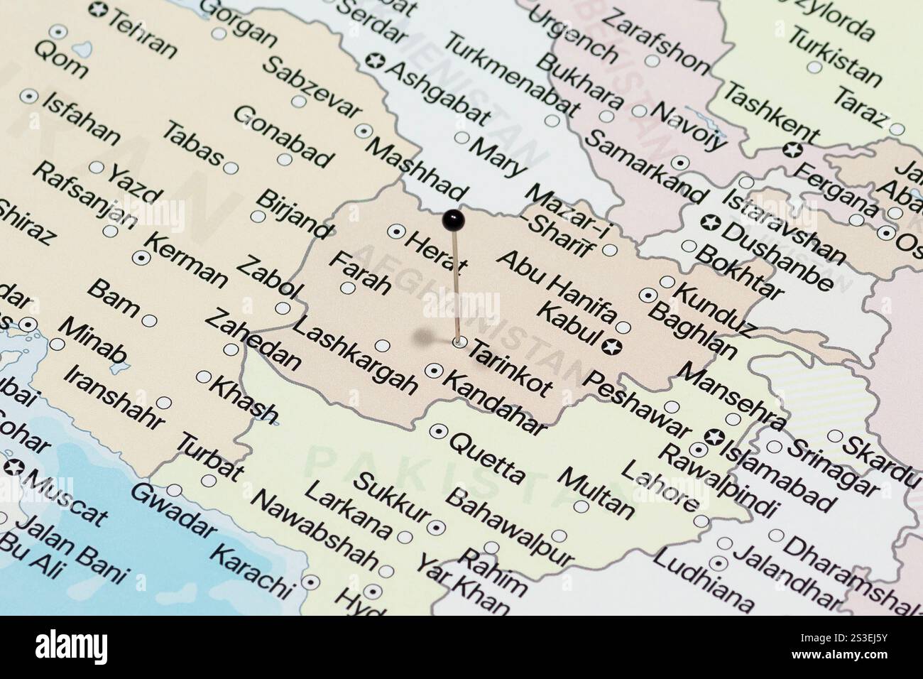 Macro photo of a black pin needle into Tarinkot city of Afghanistan ...