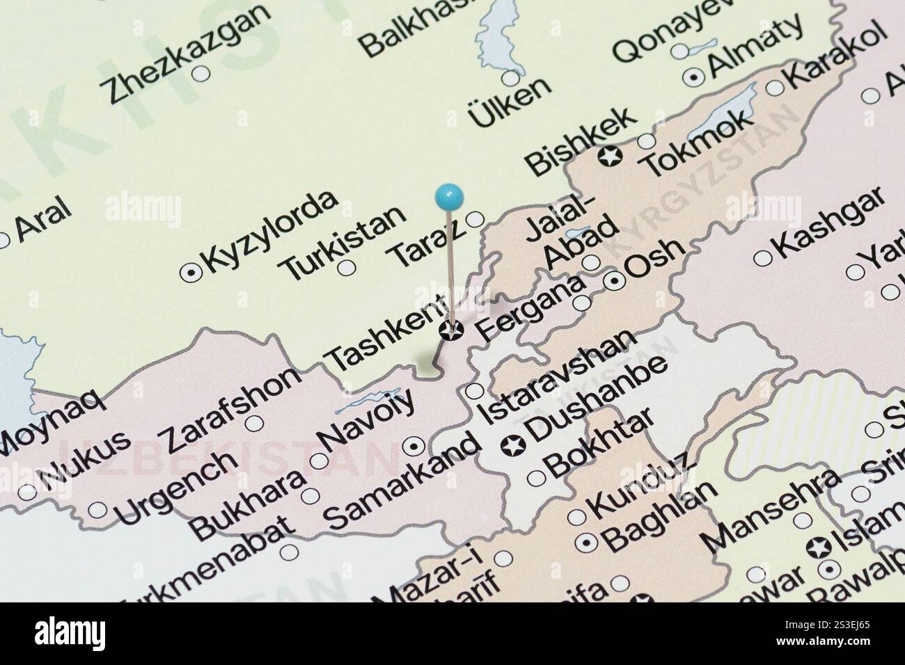 Macro photo of a light blue pin needle into Tashkent city of Uzbekistan ...