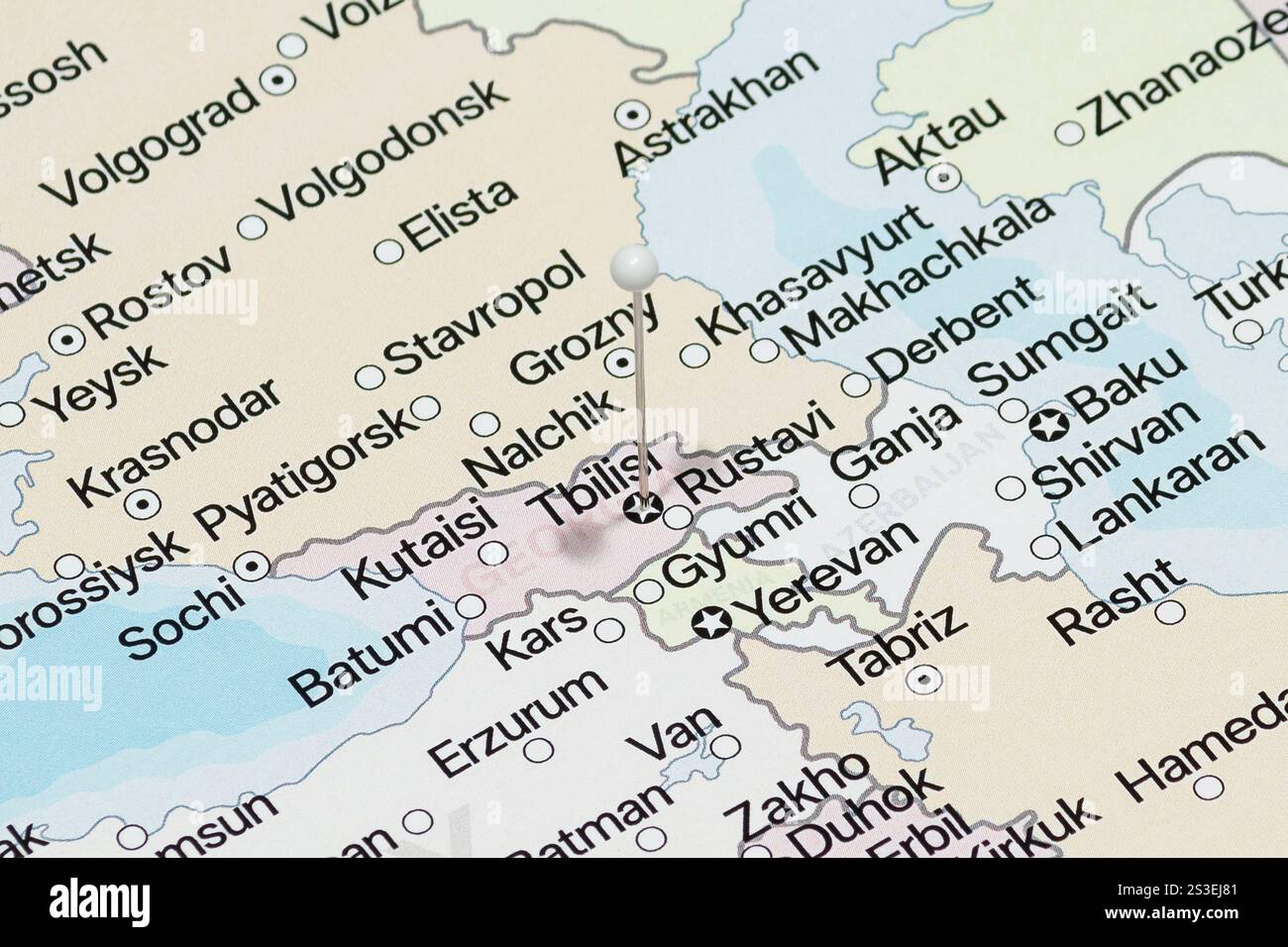 Macro photo of a white pin needle into Tbilisi city of Georgia ...