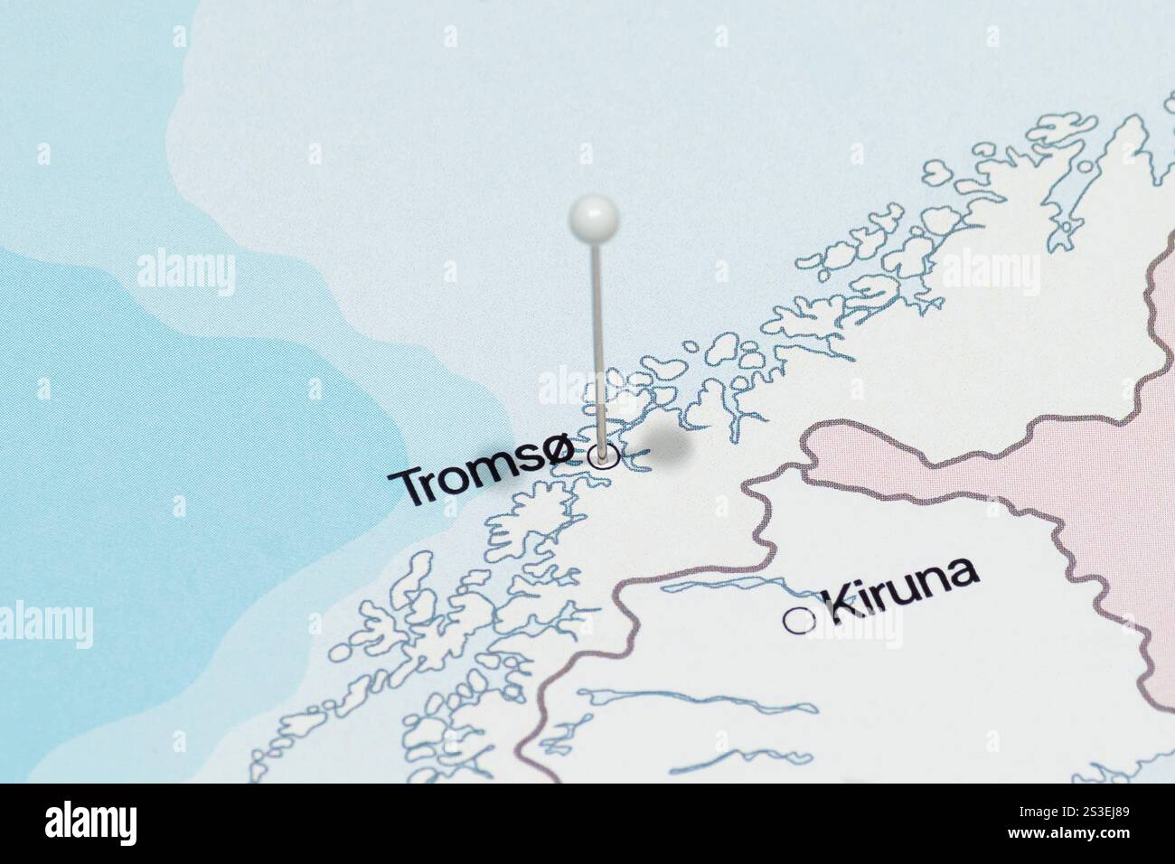 Macro photo of a white pin needle into Tromso city of Norway political ...