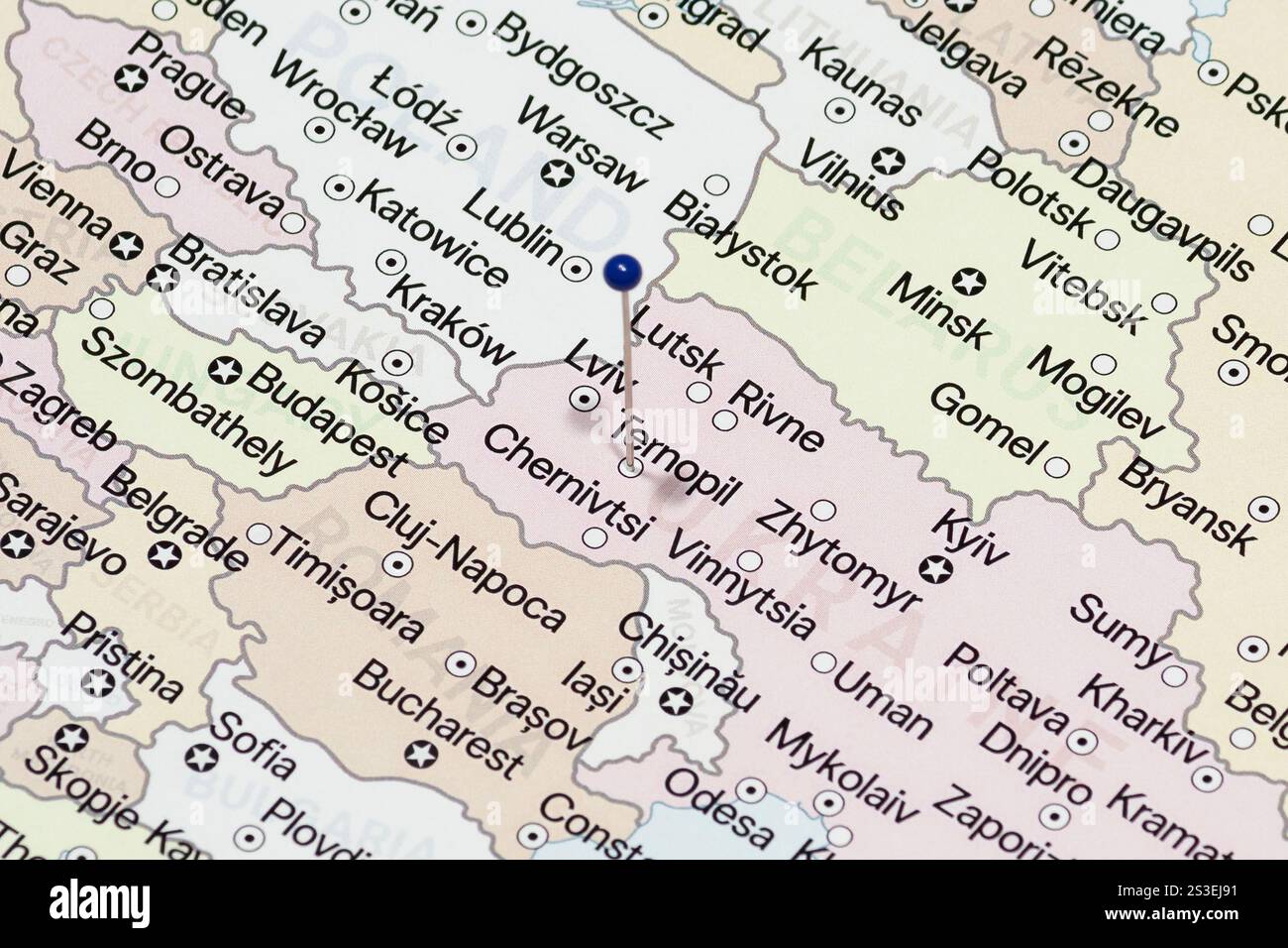 Macro photo of a blue pin needle into Ternopil city of Ukraine ...