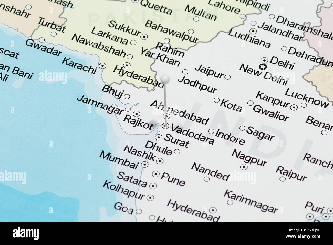 Macro photo of a white pin needle into Vadodara city of India political ...