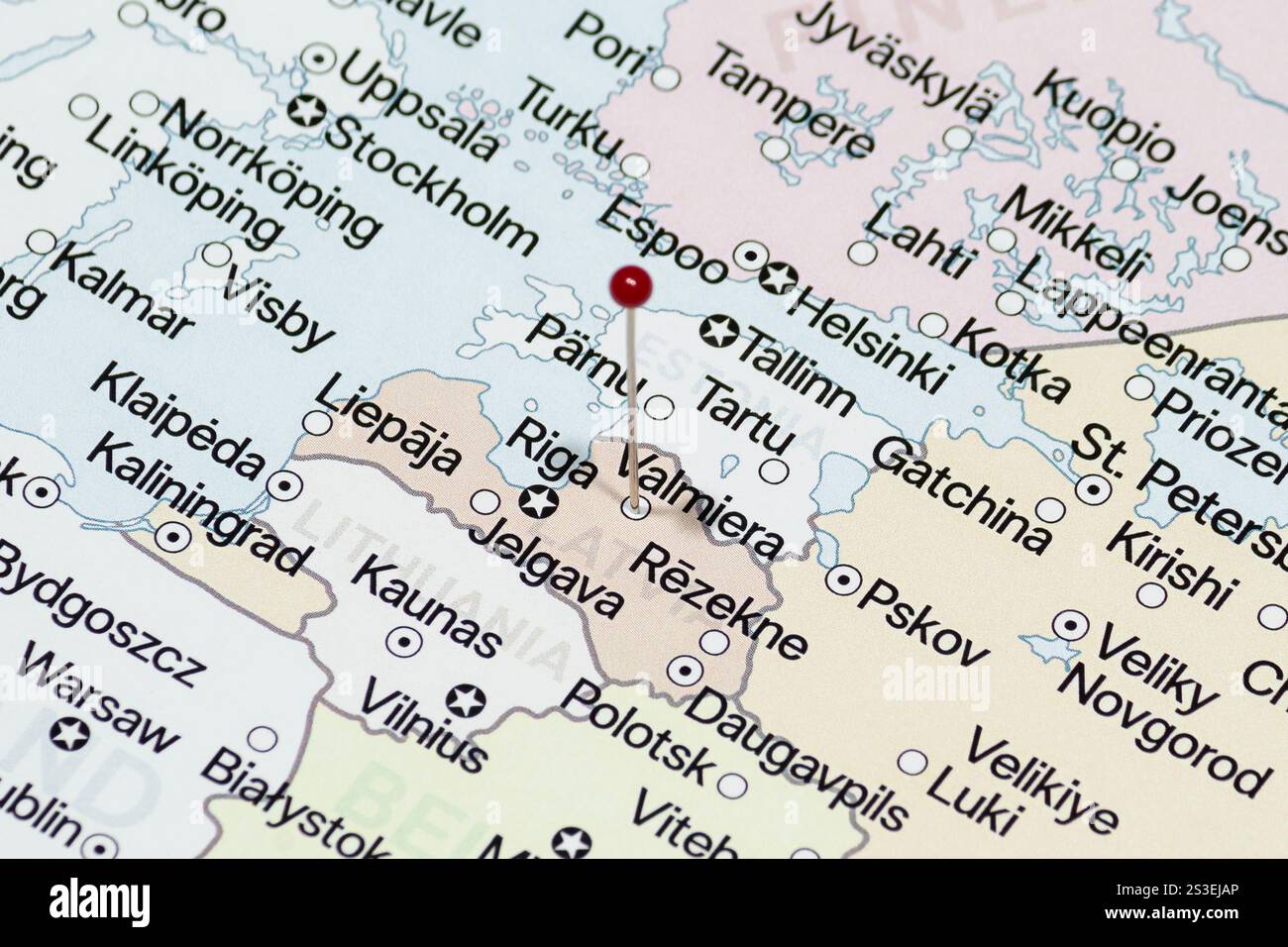 Macro photo of a red pin needle into Valmiera city of Latvia political ...
