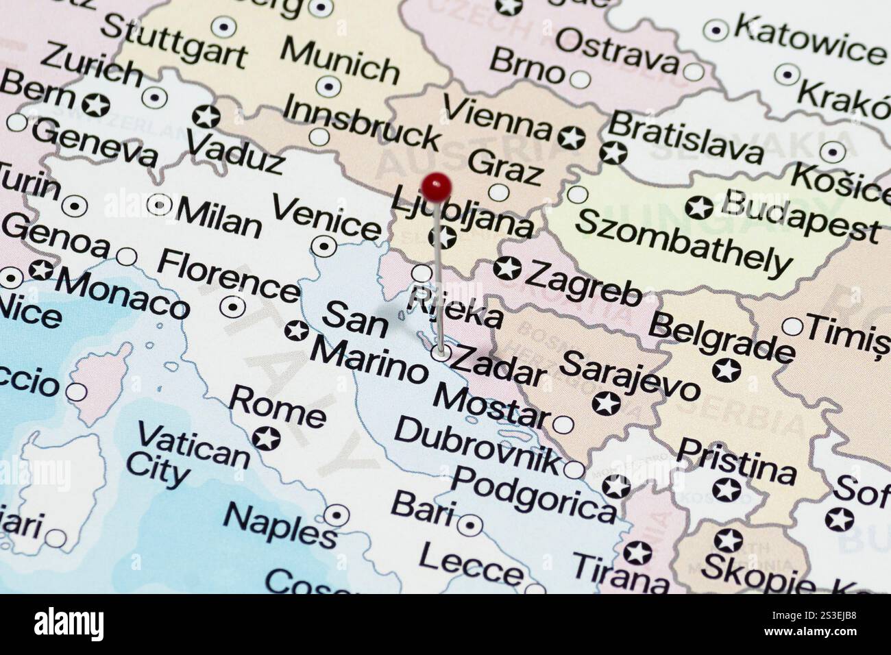 Macro photo of a red pin needle into Zadar city of Croatia political ...