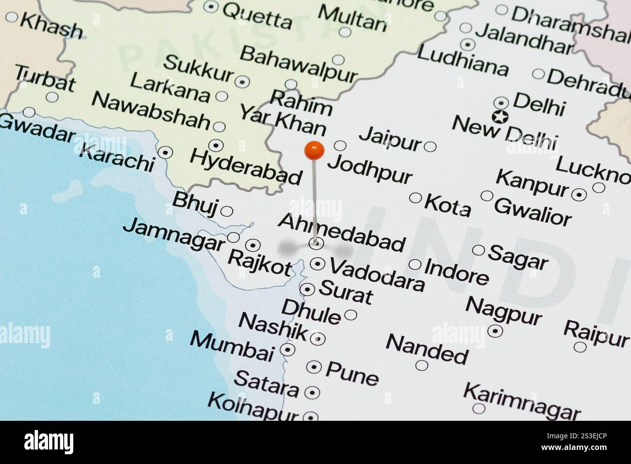 Macro photo of an orange pin needle into Ahmedabad city of India ...