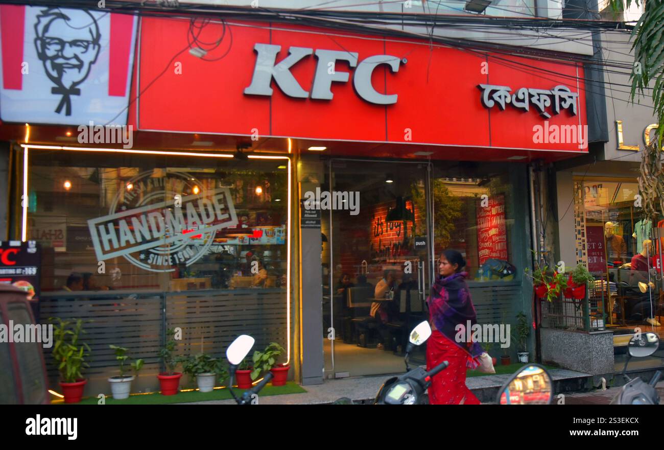 Siliguri, India. 09th Jan, 2025. People walk past the KFC (Kentucky ...