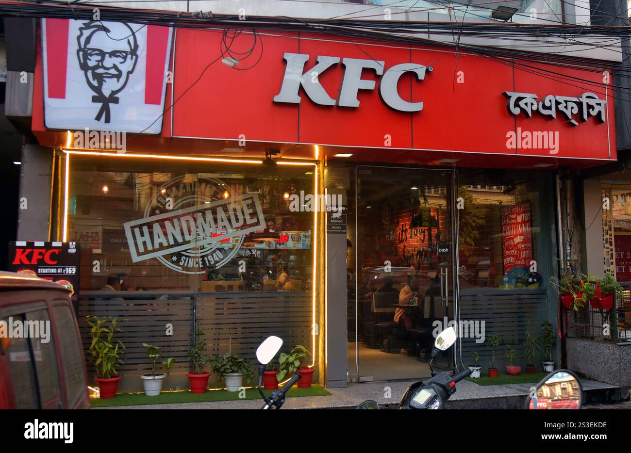 Siliguri, India. 09th Jan, 2025. People walk past the KFC (Kentucky ...