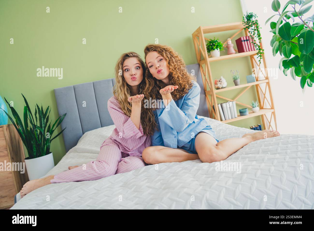Charming young women enjoying a delightful morning together in cozy ...