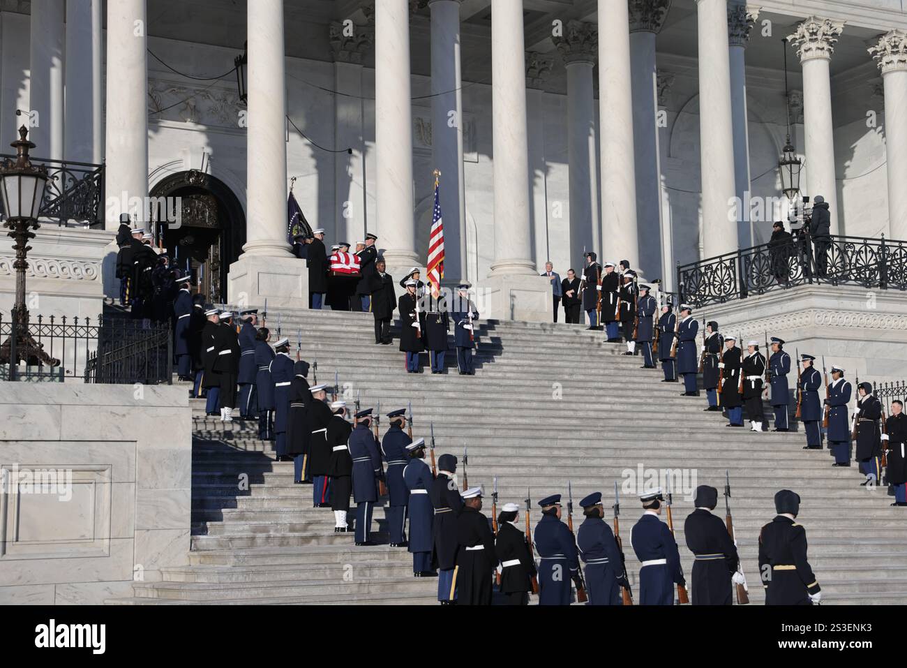 The flag-draped casket of former U.S. President Jimmy Carter is carried ...