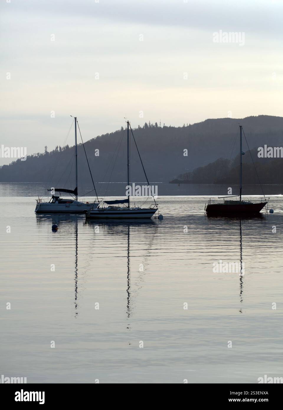 Sailing boats on Lake Windermere in the Lake District in England where ...