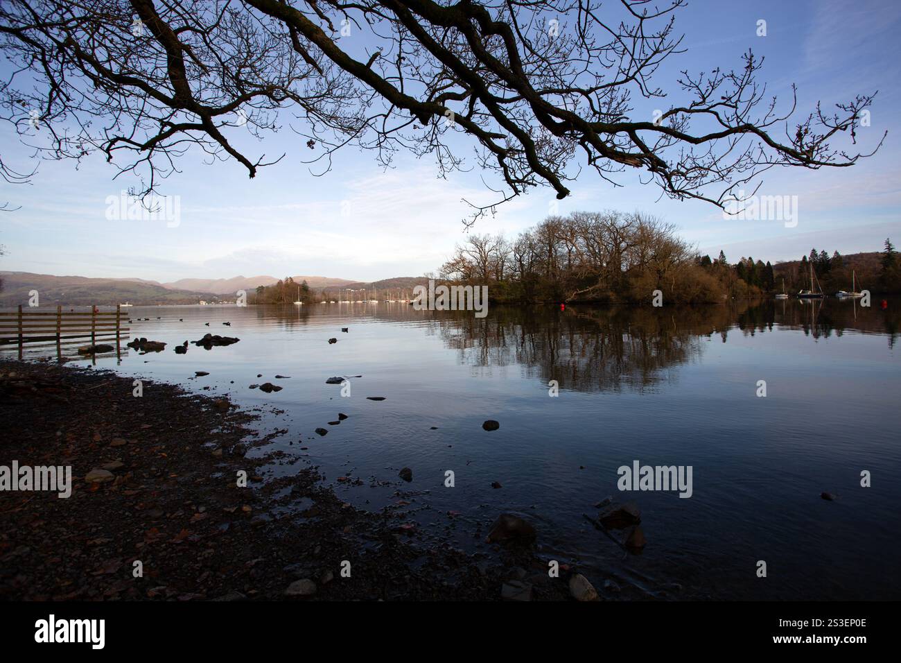 The shores of Lake Windermere in the Lake District in England where ...
