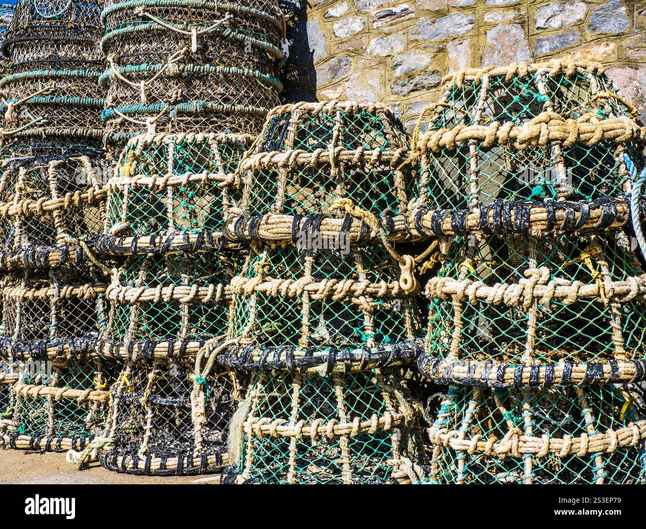 Lobster pots in the fishing harbour of Brixham in south Devon Stock ...