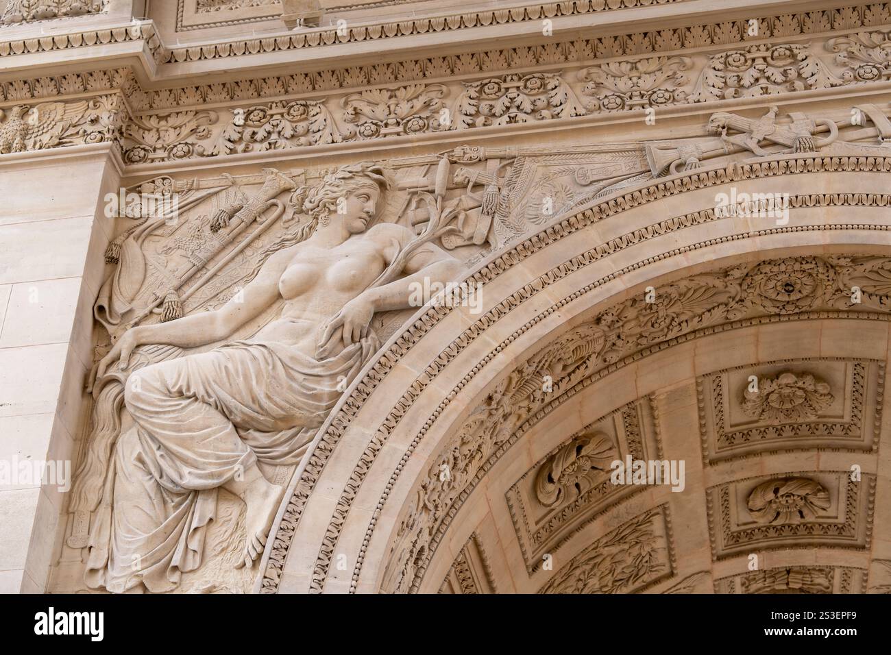 Sculptural relief depicting a female figure on an arch in a historic ...