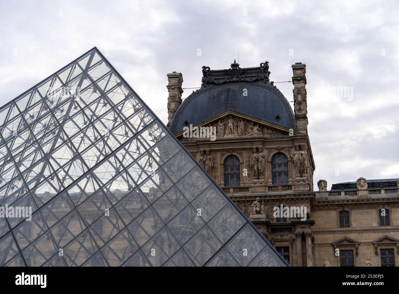 Louvre Museum exhibits modern glass pyramid alongside classical ...