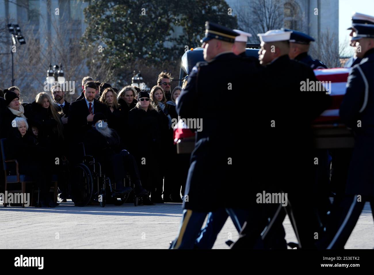 Member of the Carter family watch as a joint services body bearer team ...