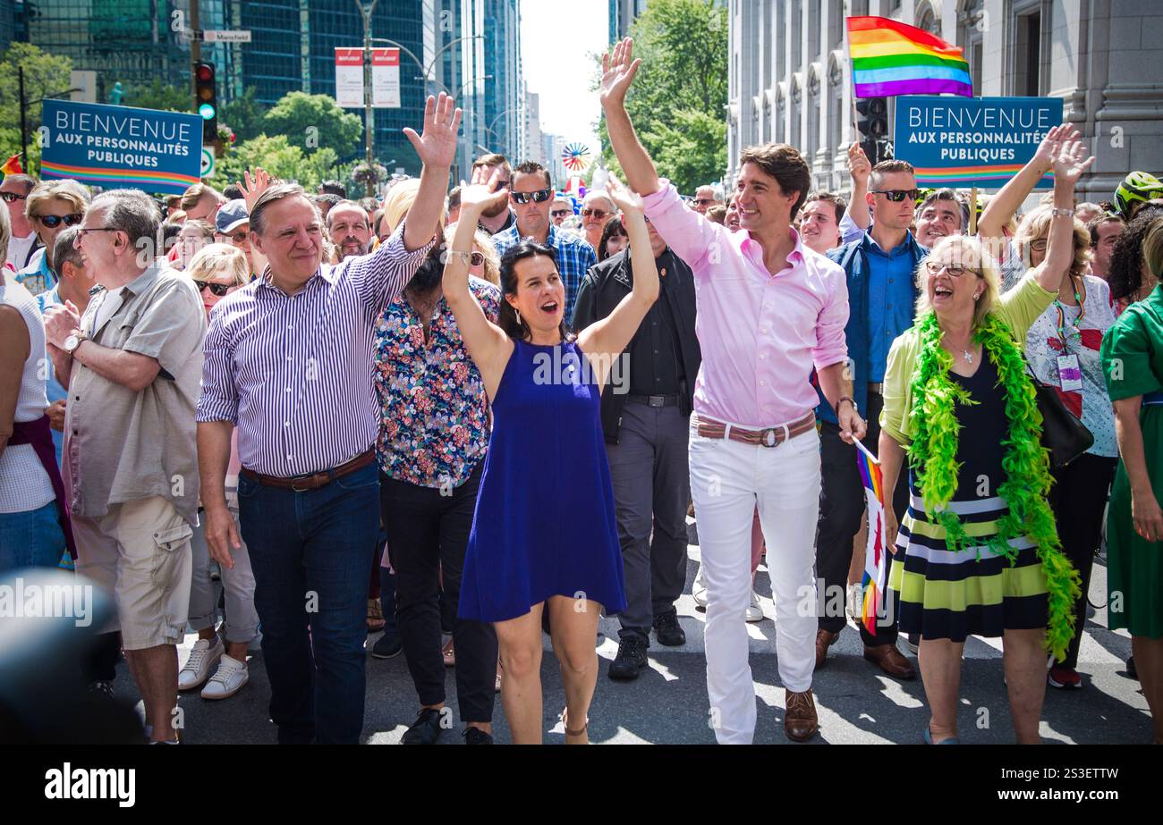 Leaders and community members marching in solidarity at a Pride parade ...