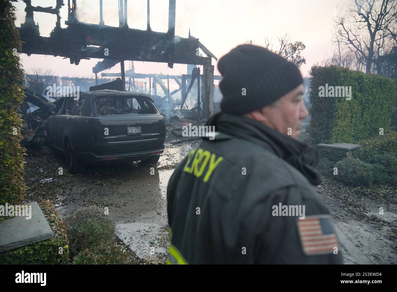 Gilroy Fire Department's Firefighter/Paramedic Kevin Bebee walks away ...