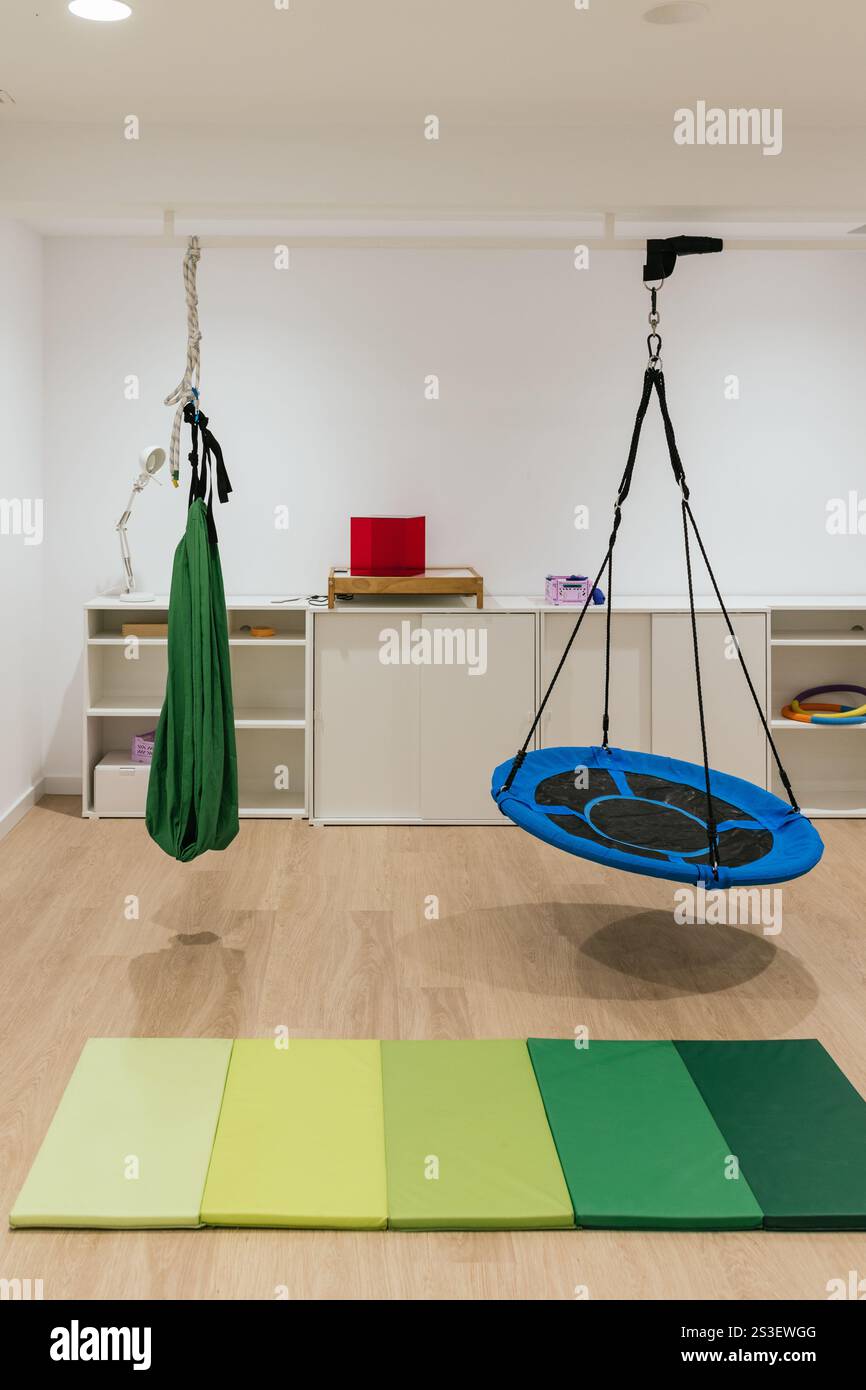 Sensory integration therapy room with hanging equipment for children ...