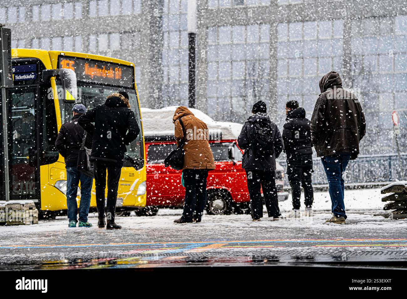 Winter weather, heavy snowfall, passengers waiting in the snow for the ...