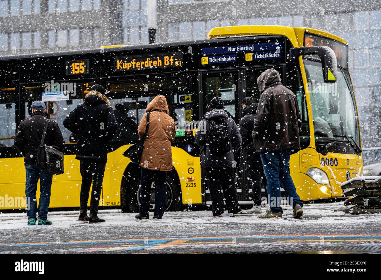 Winter weather, heavy snowfall, passengers waiting in the snow for the ...