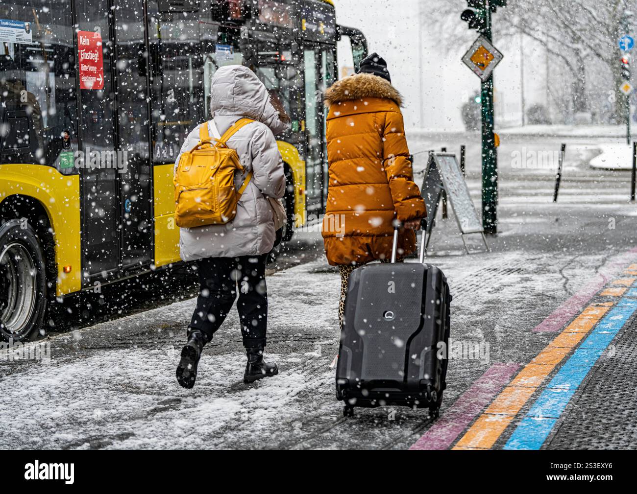 Winter weather, heavy snowfall, passengers waiting in the snow for the ...