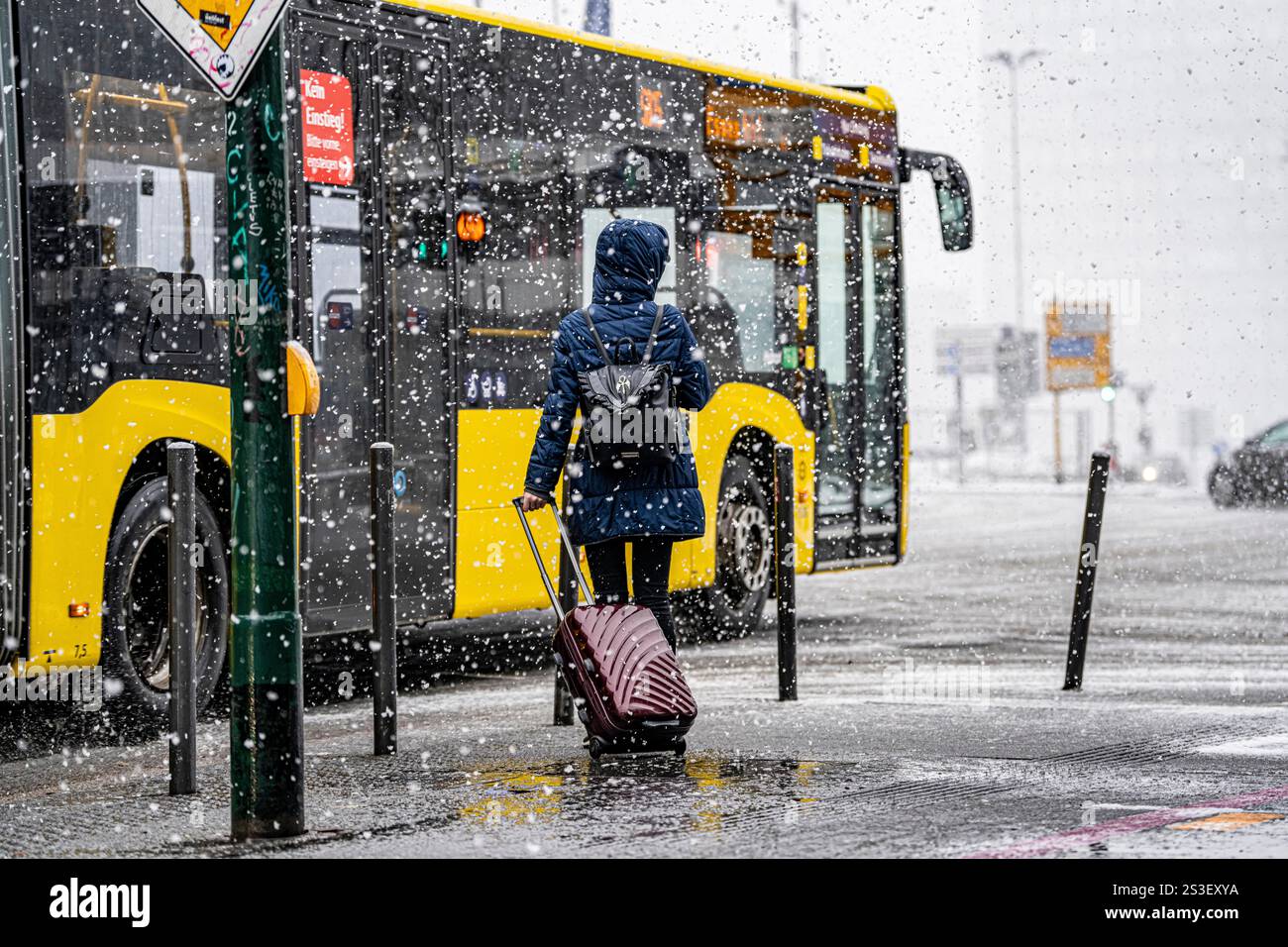 Winter weather, heavy snowfall, passengers waiting in the snow for the ...