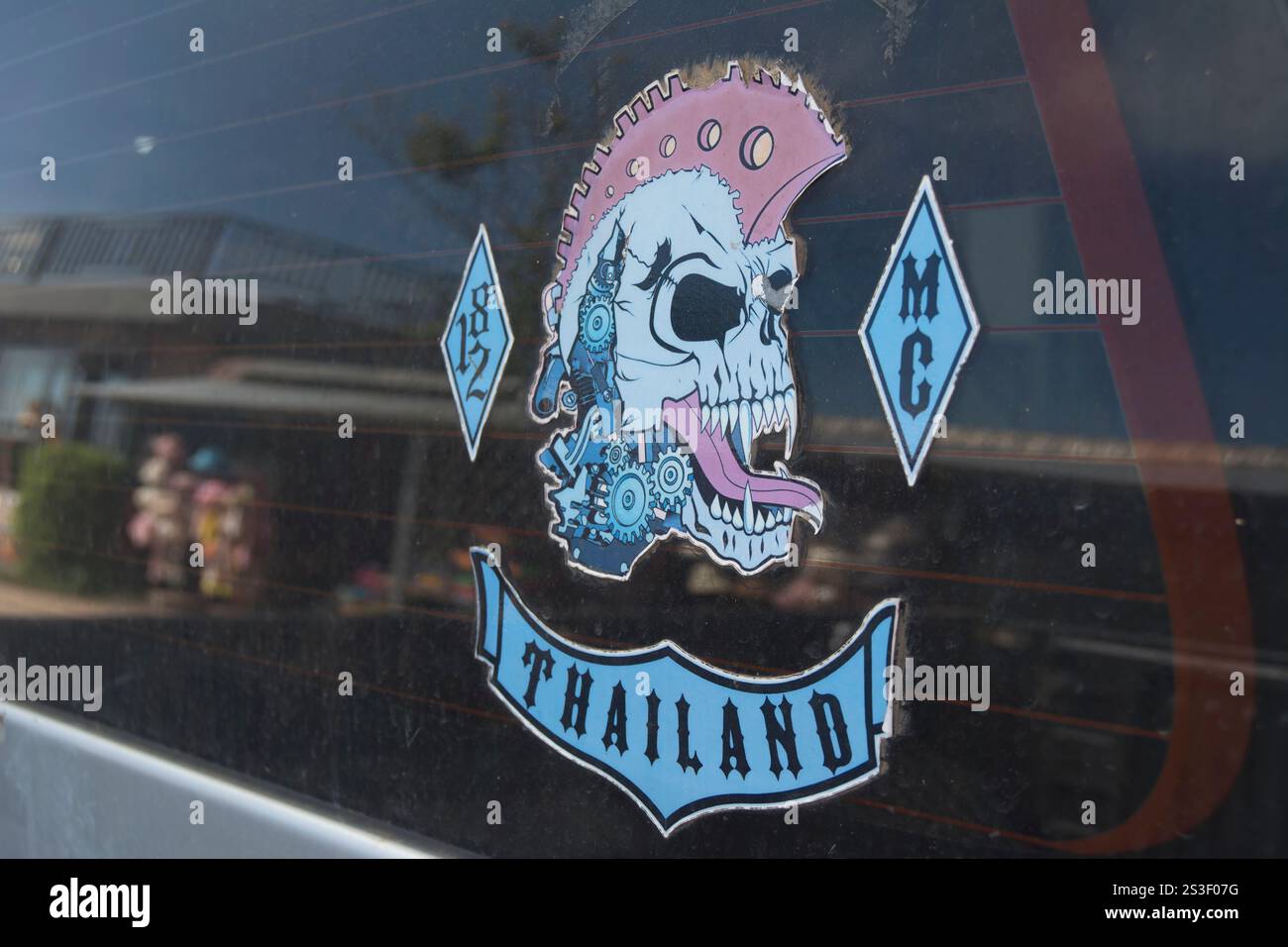 motorcycle club sticker on the rear windscreen of a pick-up truck in ...