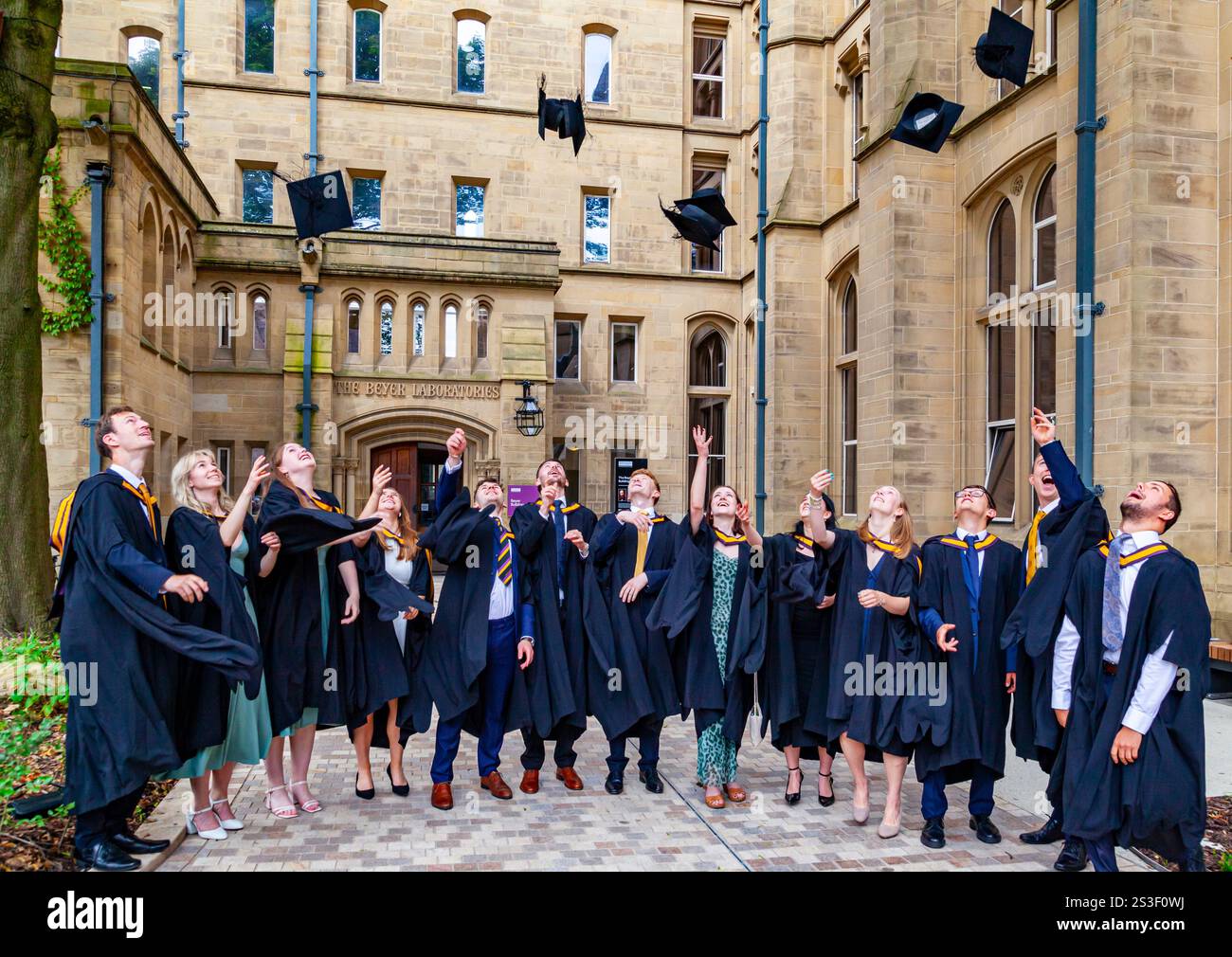 Students throwing hats at University of Manchester England UK on the ...